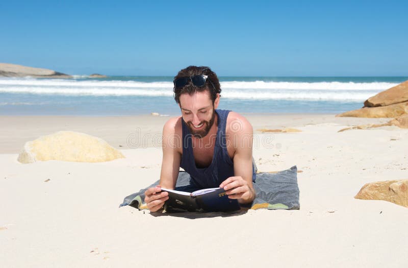 Happy Man Sitting on the Beach Reading a Book Stock Image - Image of ...