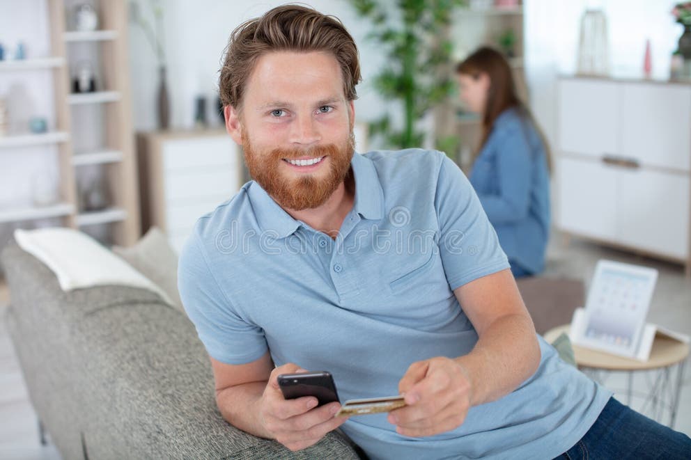 Happy Man Sitting on Coach Rest at Home Stock Image - Image of bachelor ...