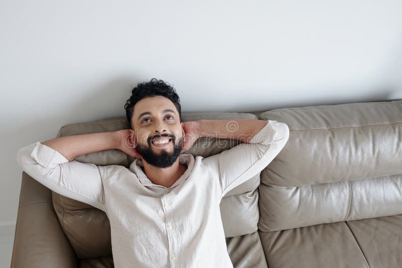 Happy Man Sitting on Comfy Sofa Stock Image - Image of comfortable ...