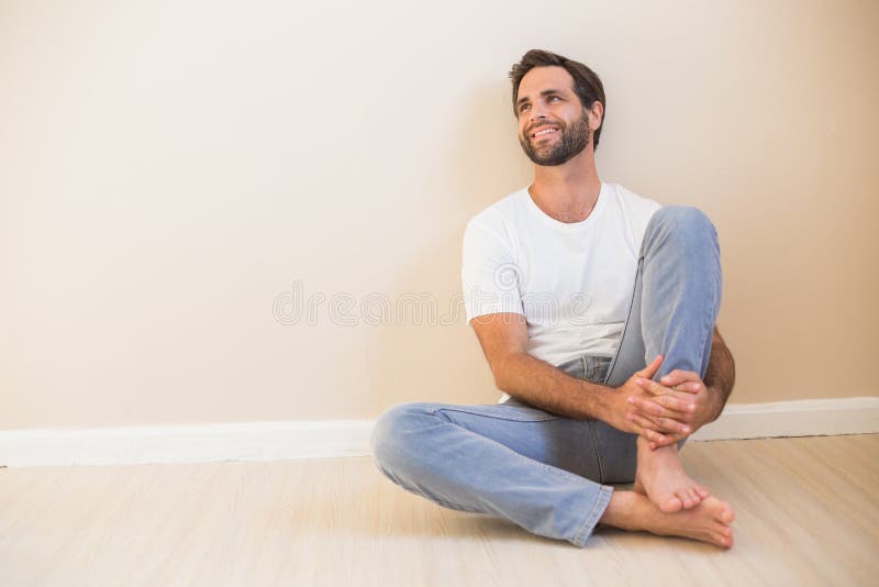 Happy man sitting on floor stock photo. Image of peaceful - 47013034