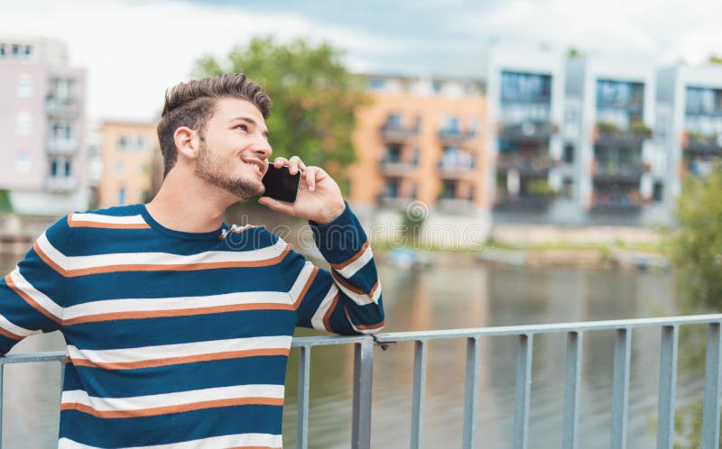 Happy Man with Smartphone Calling Outdoors Stock Image - Image of young ...