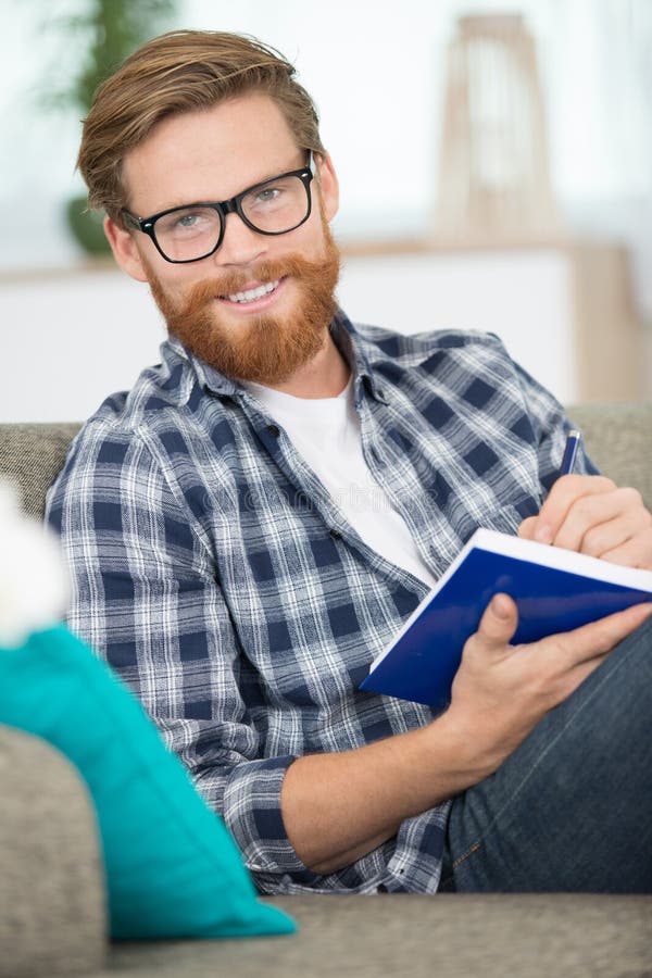 Happy man on sofa stock image. Image of relaxation, sofa - 244656045