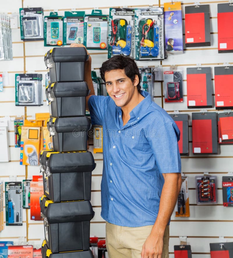 Happy Man with Stacked Toolboxes in Store Stock Image - Image of ...