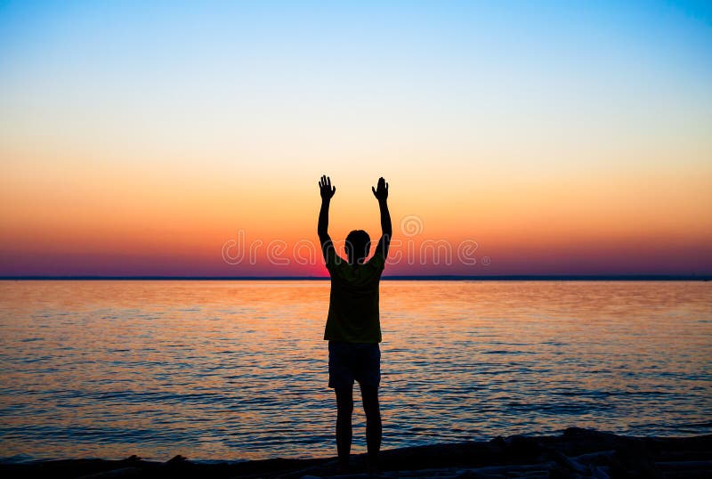 Happy Man at Sunset stock image. Image of rear, arms - 69479695