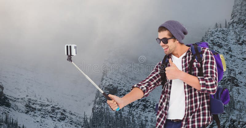 Happy Man Taking Selfie on Smart Phone Against Snow Covered Mountain ...