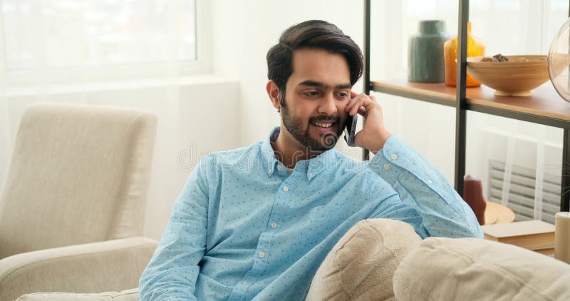 Happy Man Talking on Mobile Phone Stock Footage - Video of room ...