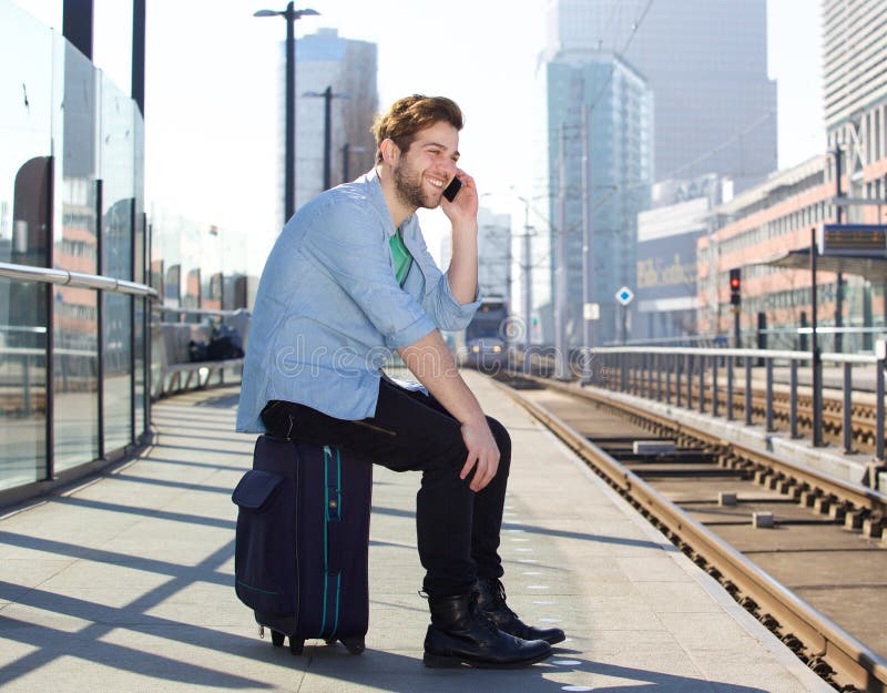 Happy Man Talking on Mobile Phone Waiting for Train Stock Photo - Image ...