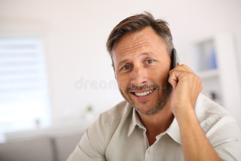Happy man talking on phone stock image. Image of portrait - 33369435