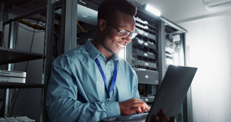 Happy Man, Technician and Laptop in Server Room for Database Update ...