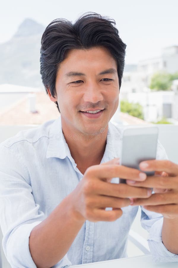 Happy man texting on phone stock photo. Image of domicile - 39430242
