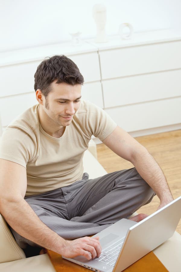 Happy man using computer stock photo. Image of happy - 10131624