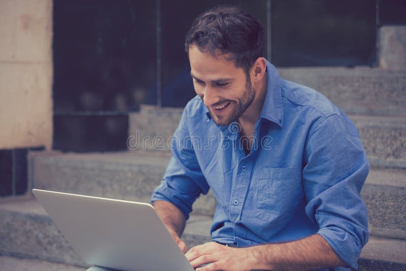 Happy Man Using His Laptop Computer Outdoors Smiling Stock Image ...