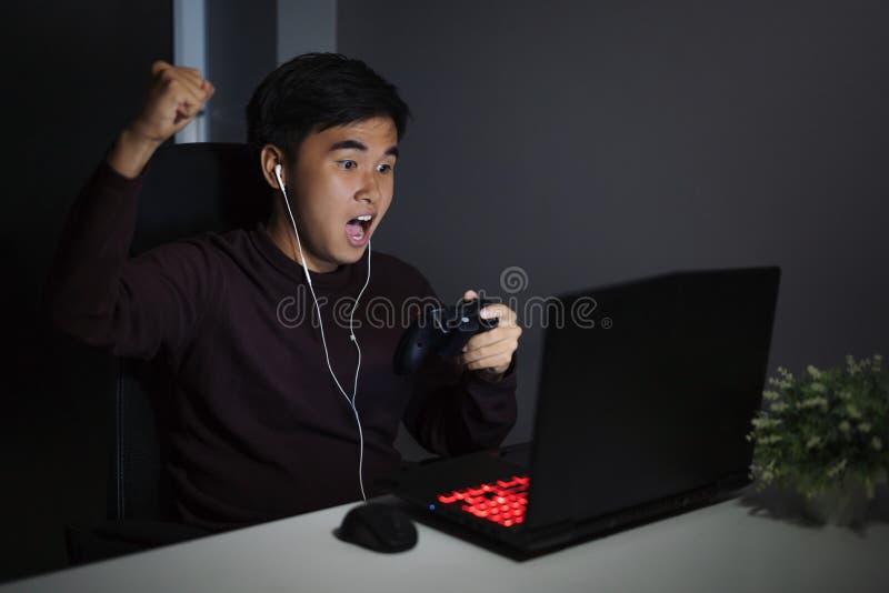 Happy Man Using Joystick To Playing Games Stock Photo - Image of ...