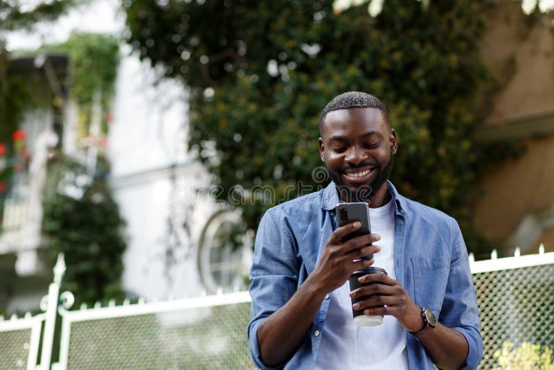 Happy Man Using Mobile Phone Apps, Texting Message, Browsing Internet ...