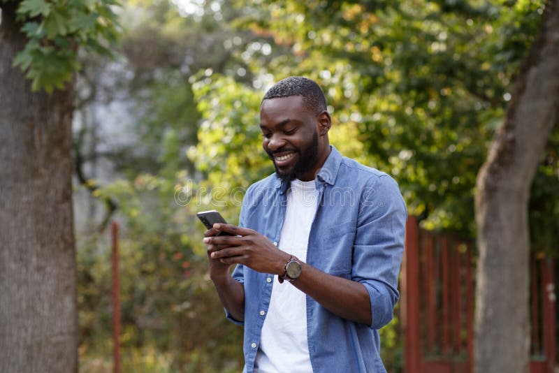 Happy Man Using Mobile Phone Apps, Texting Message, Browsing Internet ...