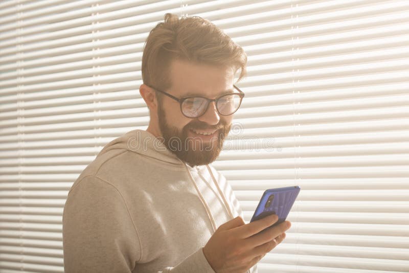 Happy Man Using Mobile Phone at Home or at Office Stock Image - Image ...
