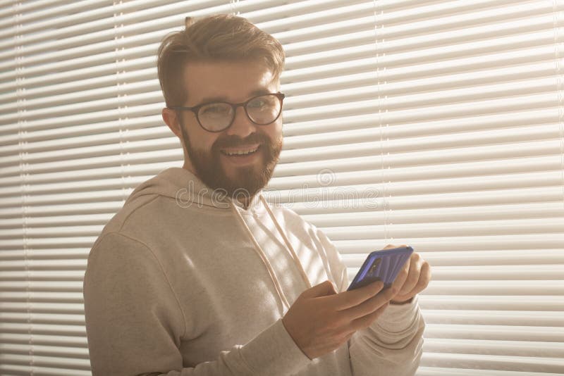 Happy Man Using Mobile Phone at Home or at Office Stock Photo - Image ...