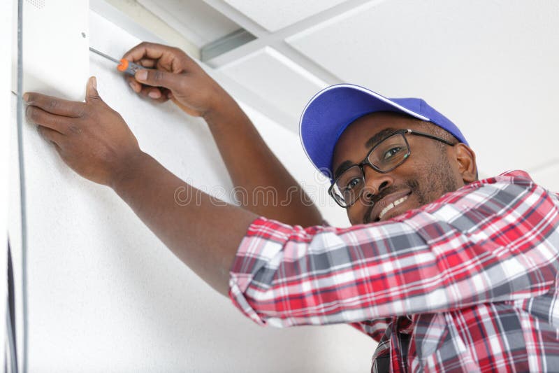 Happy Man Using Screwdriver Stock Photo - Image of fixing, hand: 309075970