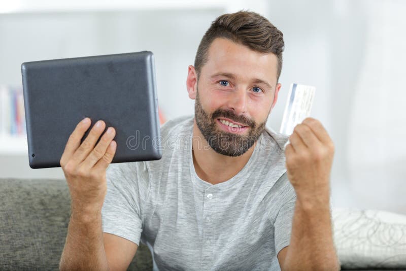 Happy Man Using Tablet and Credit Card Stock Image - Image of ...