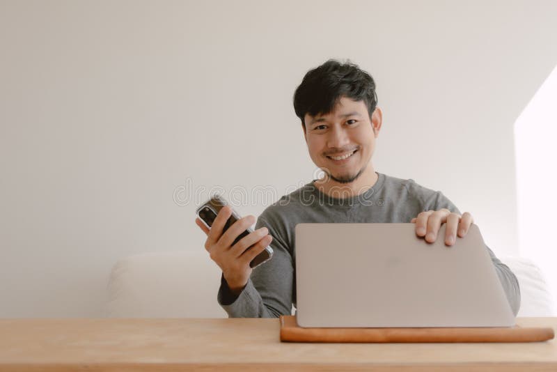Happy Man Working on Computer Feeling Happy with the App in Mobile ...