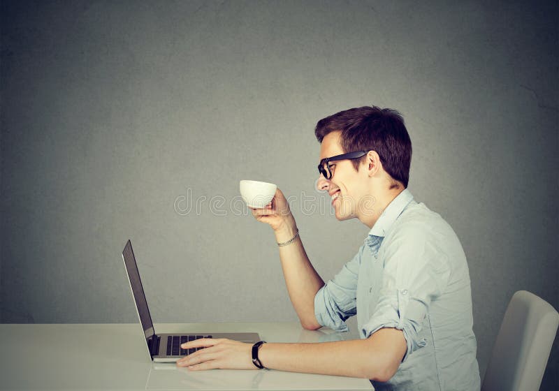 Happy Man Working on Laptop Drinking Coffee Stock Photo - Image of ...