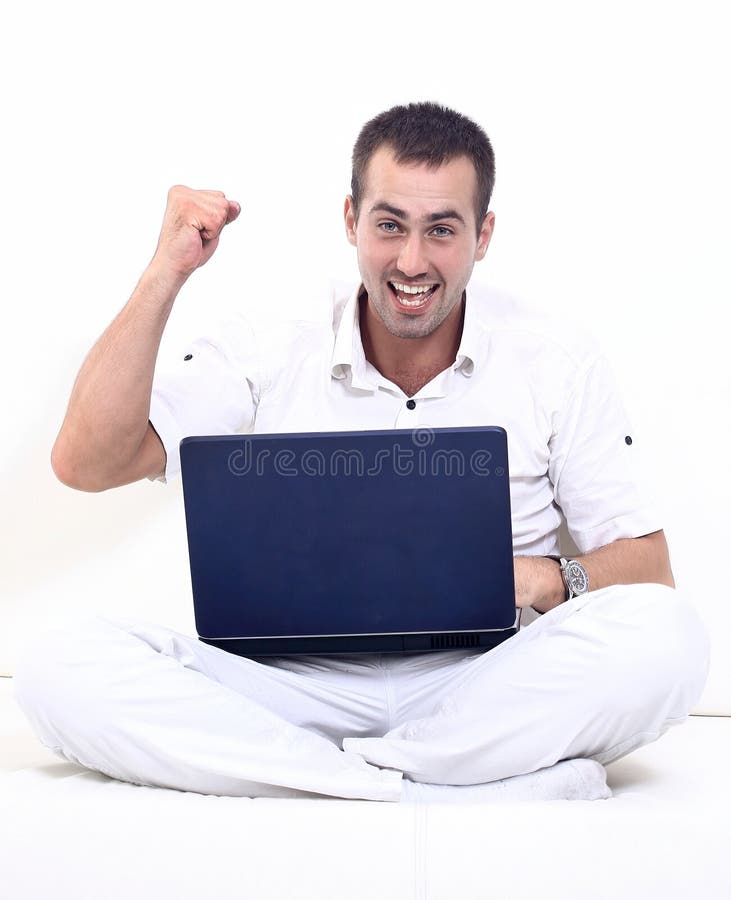 Happy Man Working on Laptop, Sitting on the Couch. Stock Photo - Image ...