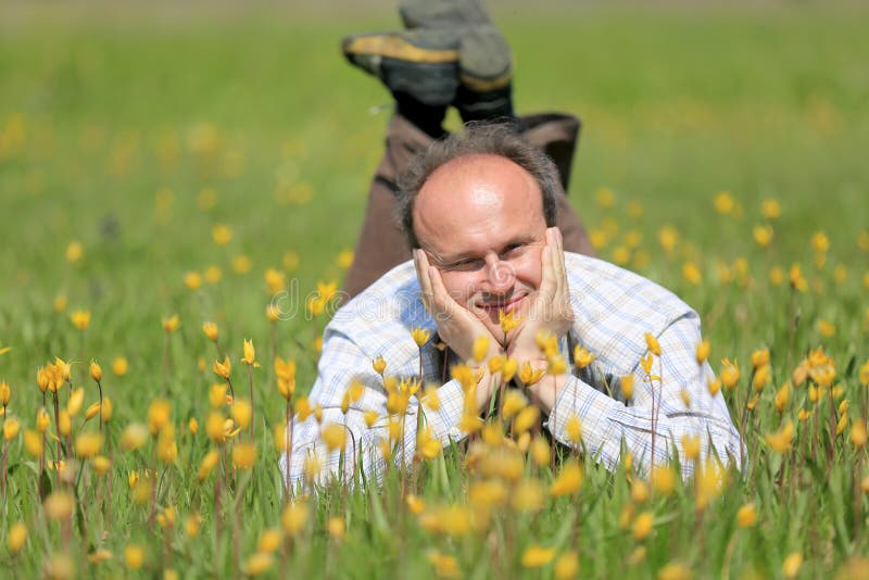 Happy Man In Yellow Wild Flowers Stock Image - Image of adult, person ...