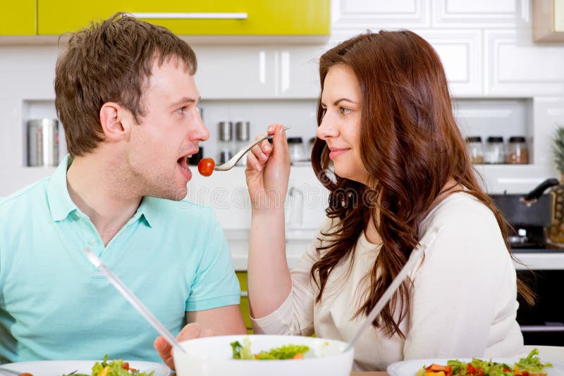 Happy Married Couple Feeding One Another with Tomatoes Stock Image ...