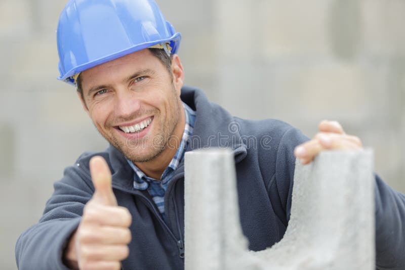Tradesman giving thumbs up stock image. Image of industrial - 279022899