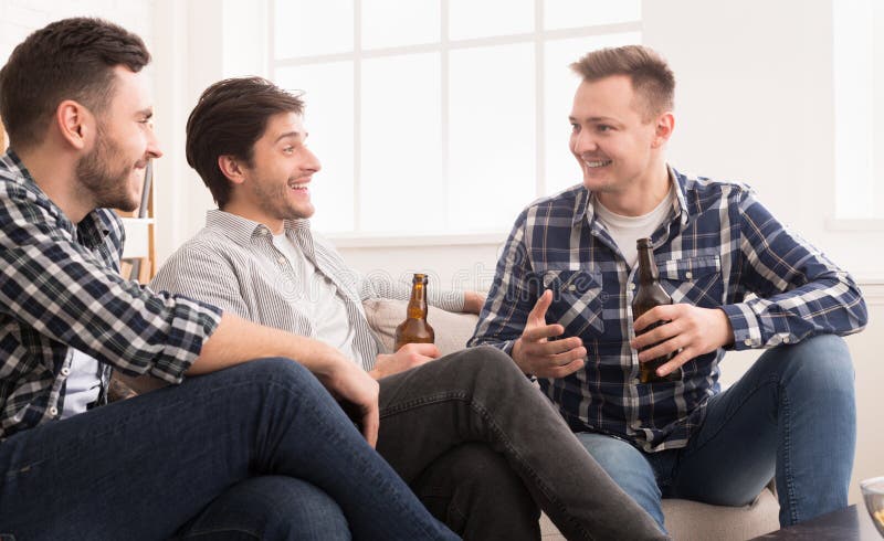 Happy Mates Drinking Beer and Talking at Home Stock Image - Image of ...