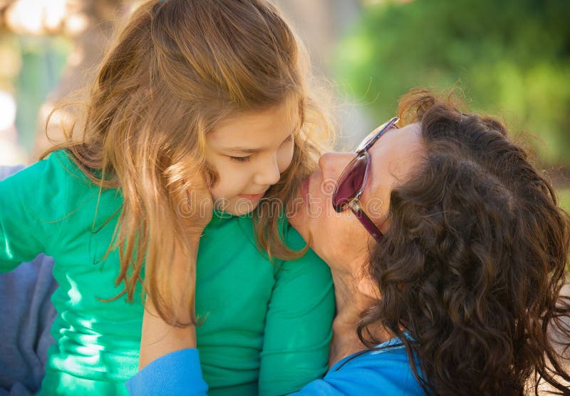 Happy Mather and Children in Park Stock Photo - Image of child ...