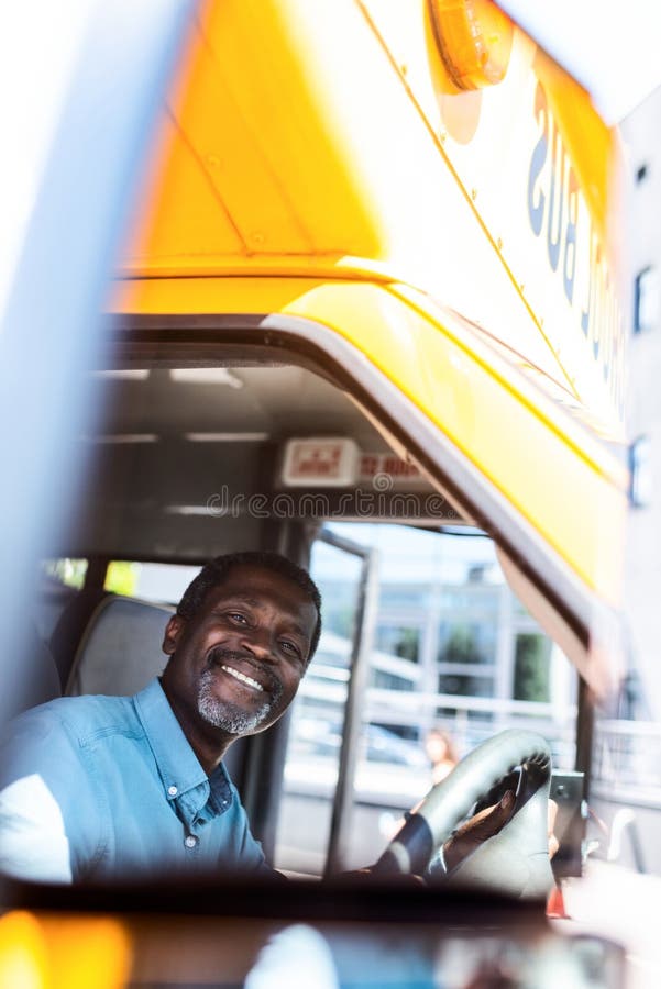Happy Mature African American Bus Driver Looking Stock Photo - Image of ...
