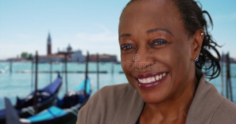 Happy Mature Black Woman Standing By Grand Canal Smiling And Laughing Stock Video Video Of