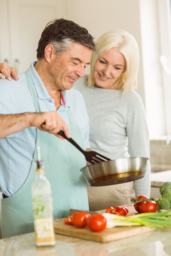 Happy Mature Couple Making Dinner Together Stock Photo - Image of ...