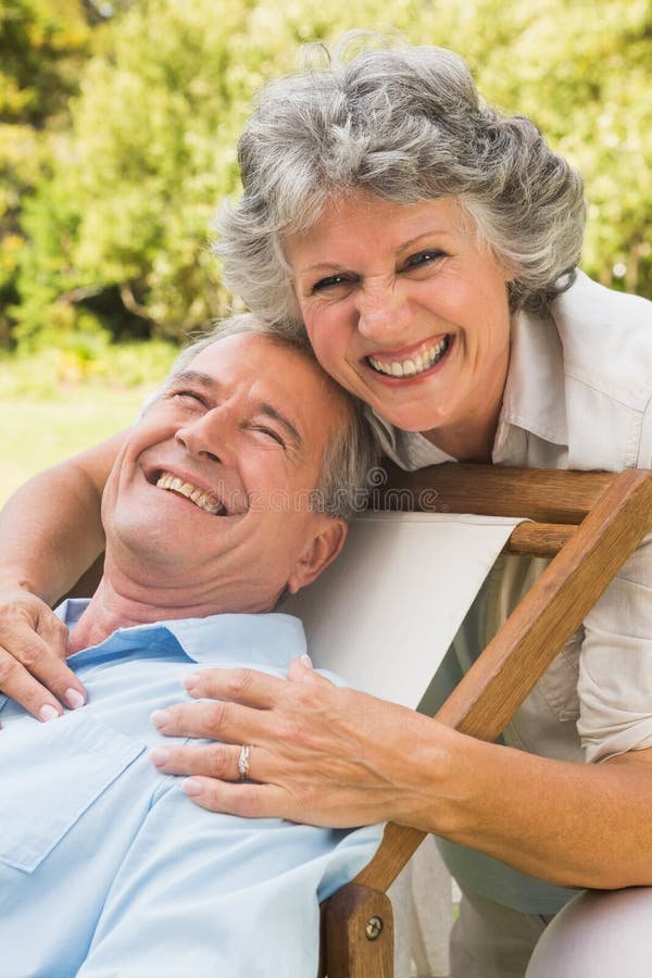 Happy Mature Couple Smiling at Camera Stock Image - Image of parkland ...