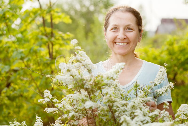 Happy mature gardener stock image. Image of gardening - 25140661