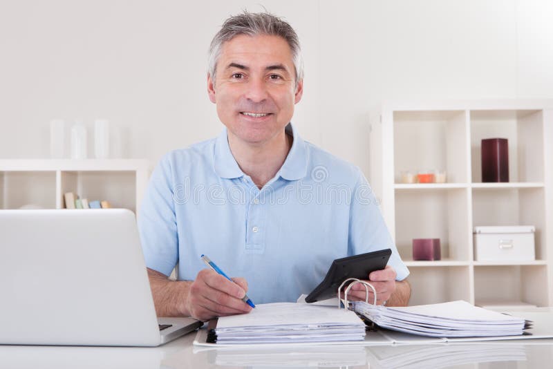 Happy Mature Man Calculating Stock Image - Image of computer, financial ...