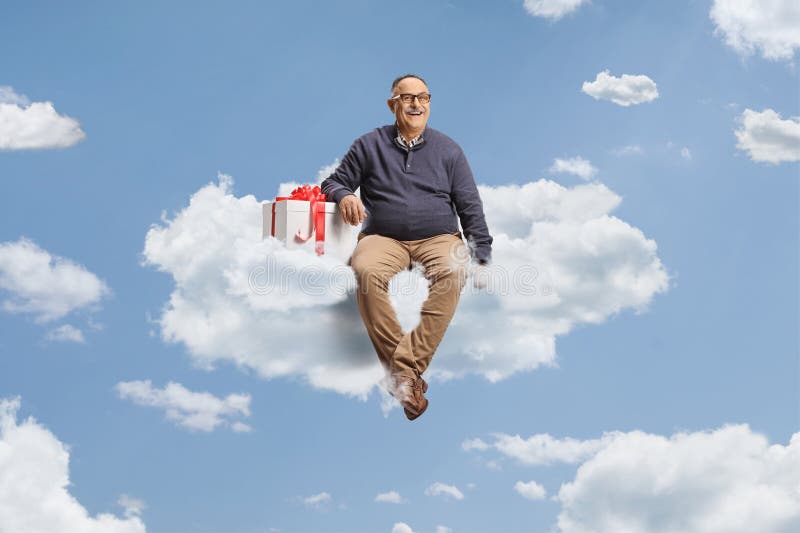 Happy Mature Man with a Gift Box Sitting on a Cloud Stock Image - Image ...