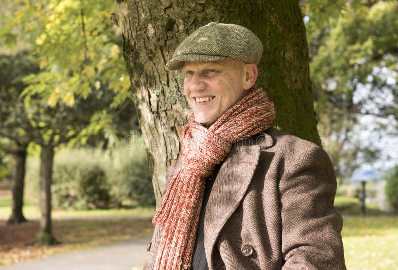 Happy Mature Man Standing Under a Tree Outdoors. Stock Photo - Image of ...