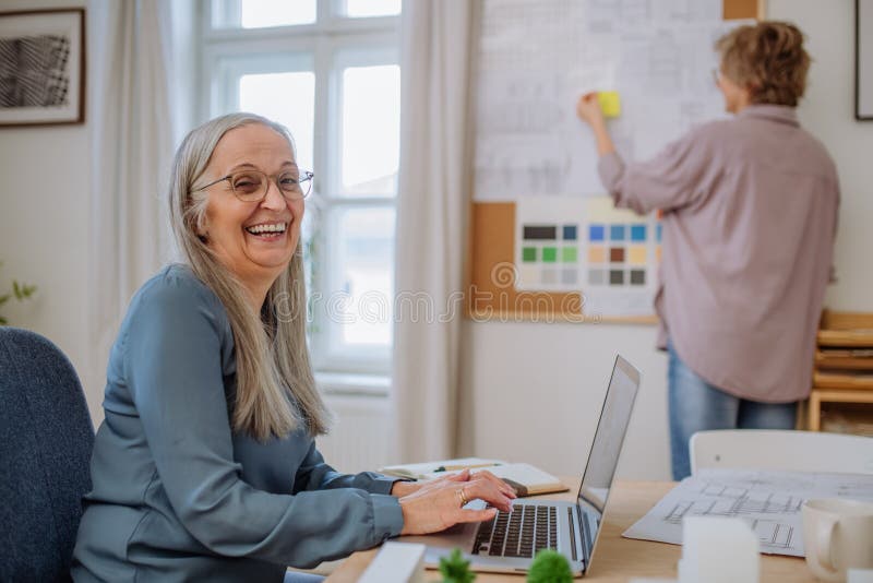 Happy Mature Women Eco Architects Working Together in Office. Stock ...