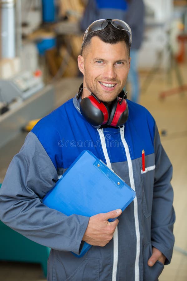 Happy Mechanic Man with Clipboard at Car Workshop Stock Image - Image ...