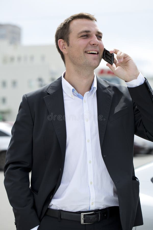 Happy men calling by phone stock image. Image of message - 56419943