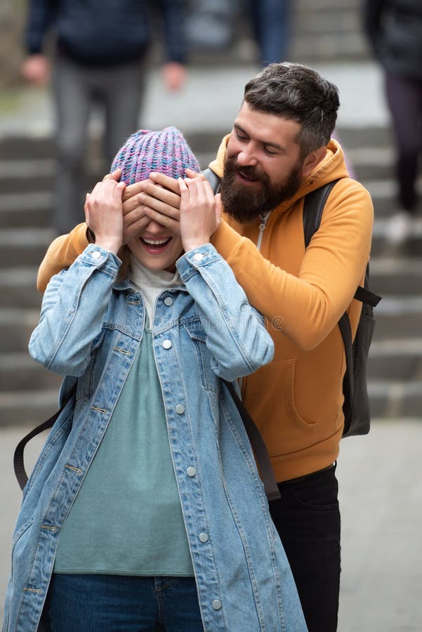 Happy Man Closing Eyes of Lady with Attractive Smile with Hands Stock ...