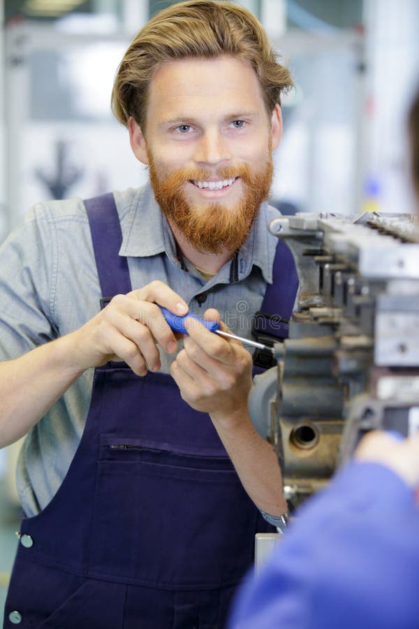 Happy Man Talking To Apprentice about Engine Fixing Stock Photo - Image ...