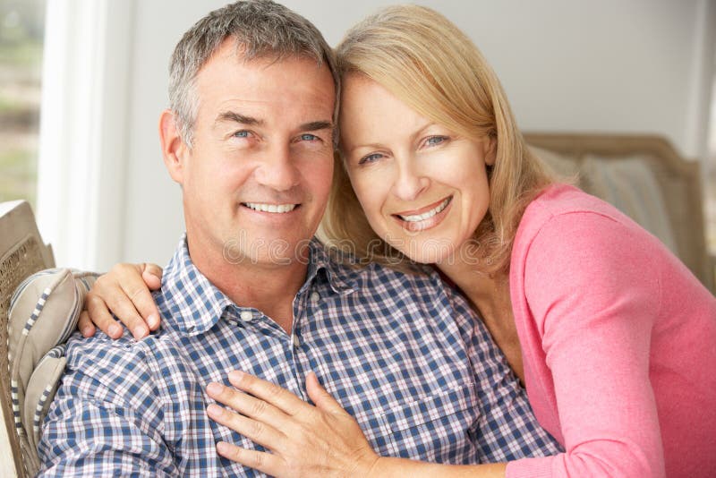Happy Mid Age Couple at Home Stock Image - Image of home, looking: 21030267
