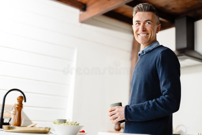 Happy Mid Aged White Man Holding Cup Standing Stock Image - Image of ...