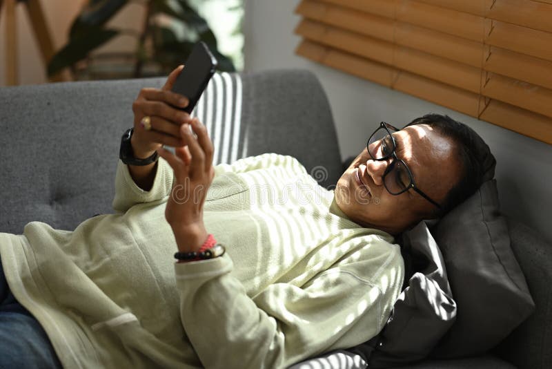 Happy Middle Age Man Chatting Online in Social Network with Smart Phone ... Happy Middle Age Man Chatting Online in Social Network with Smart Phone ...