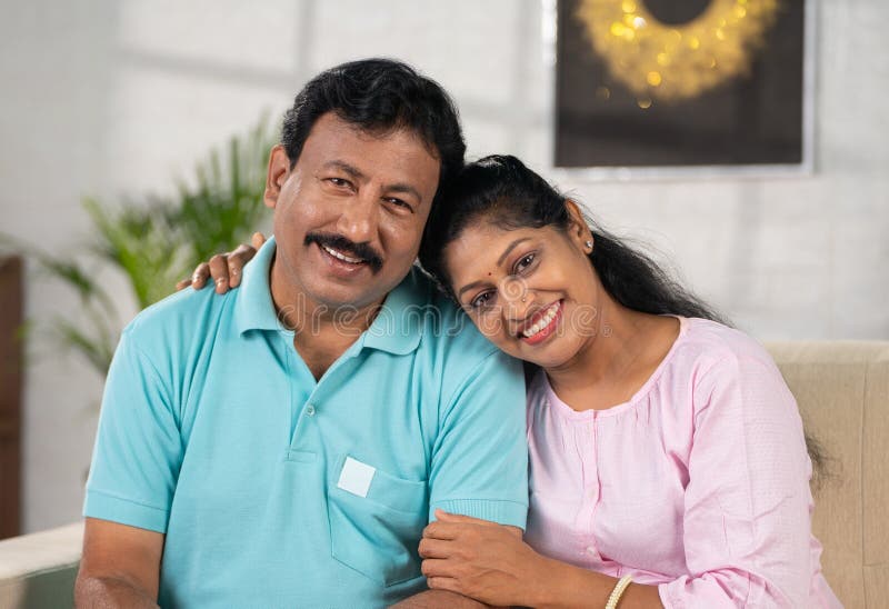 Indian Relaxed Middle Aged Couple Using Laptop While Having Coffee At Home Concept Of Leisure 3451