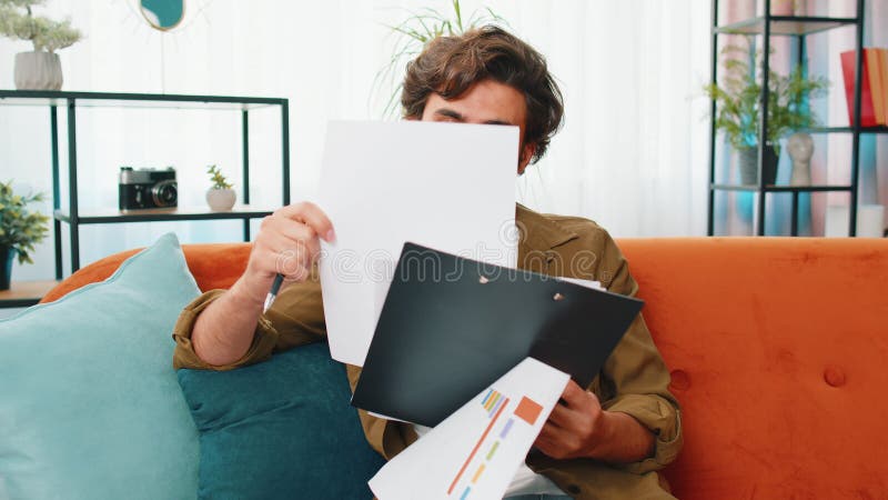 Happy Man Freelancer Work with Documents from Home, Analyzing ...