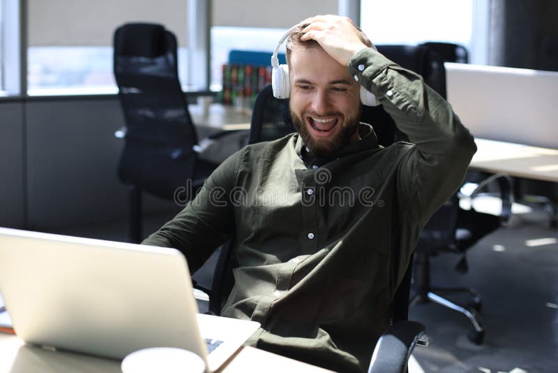 Happy Modern Business Man Working Using Laptop while Sitting in the ...